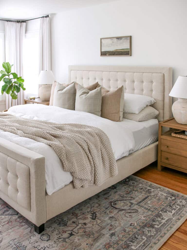 How to Hang Art Above a Bed with Style - Stefana Silber